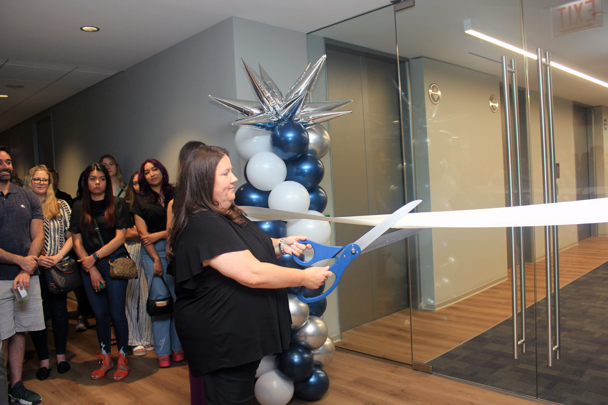 Kristen L. Fitzpatrick, CPA, Managing Principal, cut the celebratory ...